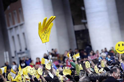 VATICAN POPE SMILEY PLACARDS